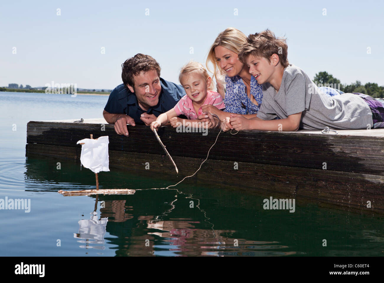 Boys with toy boat hi-res stock photography and images - Alamy