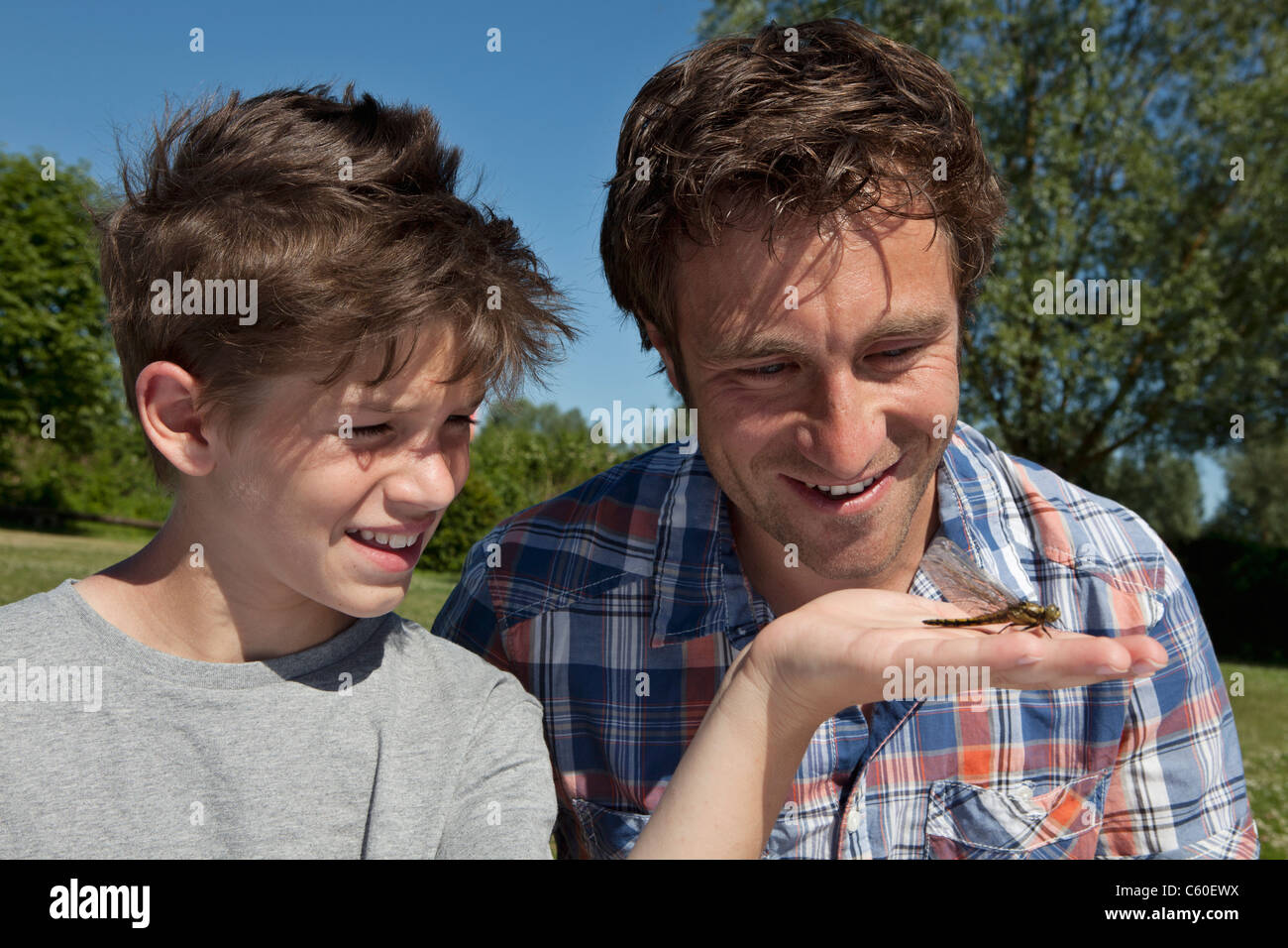Father and son looking at insect hi-res stock photography and images ...