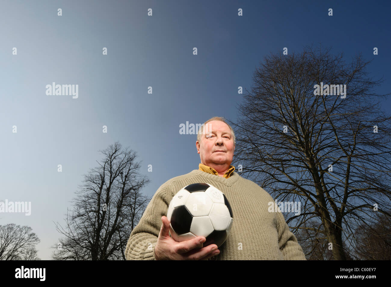 Older man playing football hi-res stock photography and images - Alamy