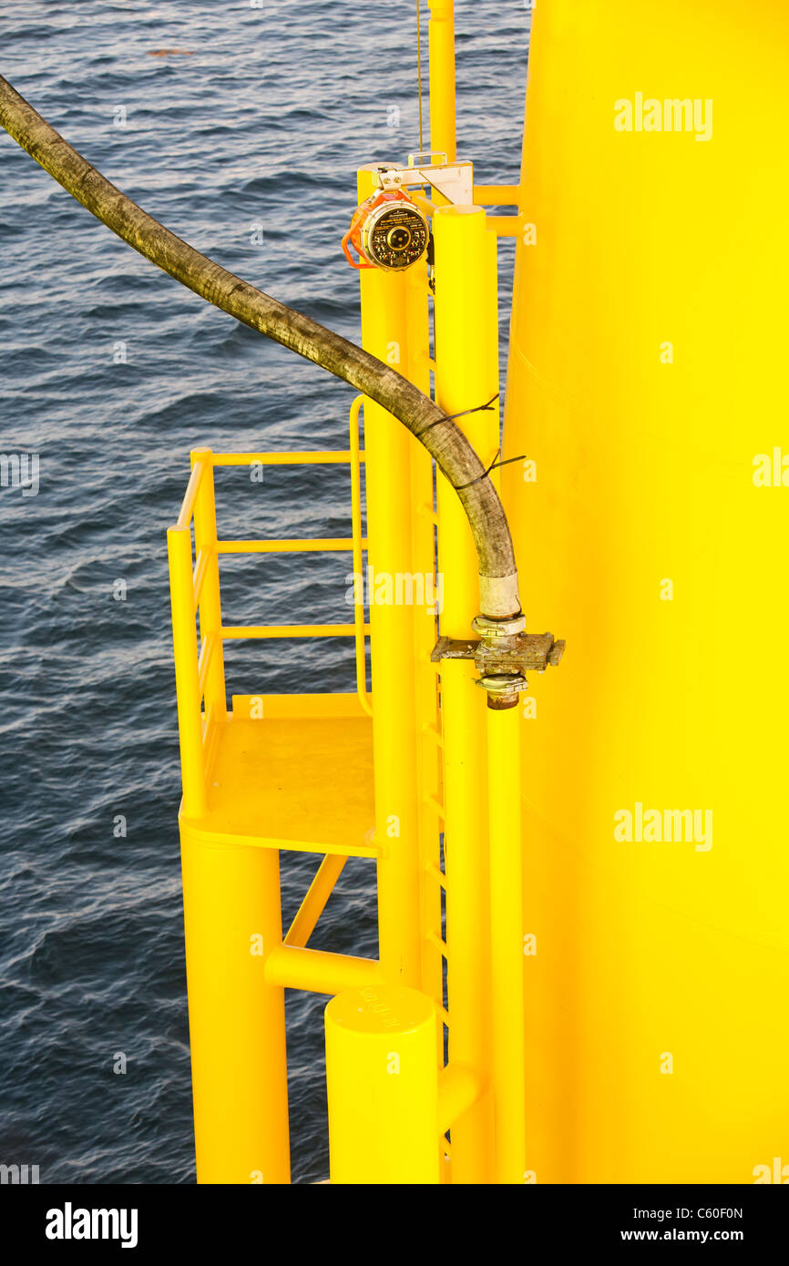 A pipe carries specialist grout to cement a transition piece to a ...