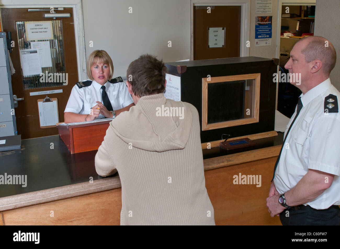 Police detain white male suspect Stock Photo - Alamy