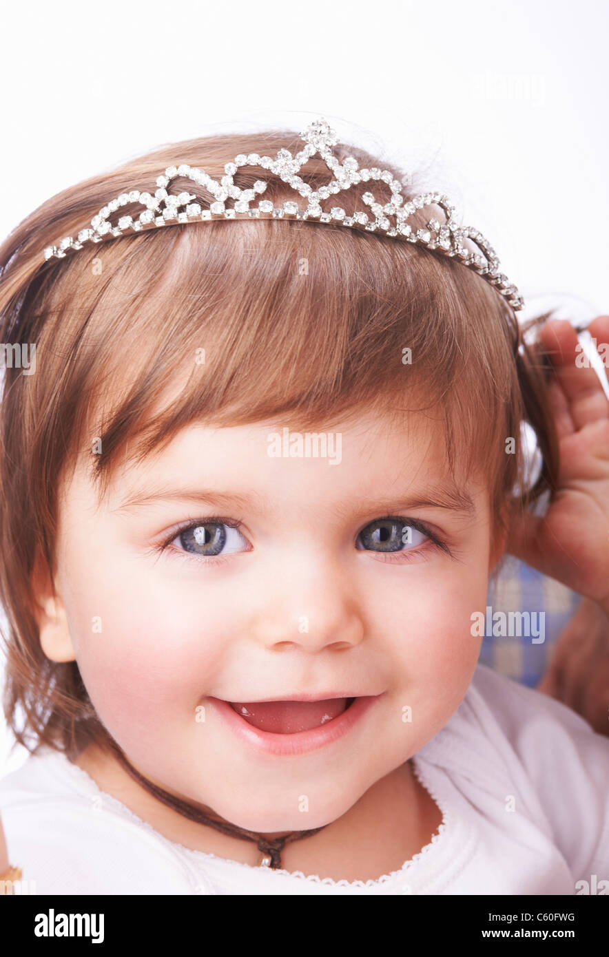 Baby girl wearing diamond tiara Stock Photo - Alamy