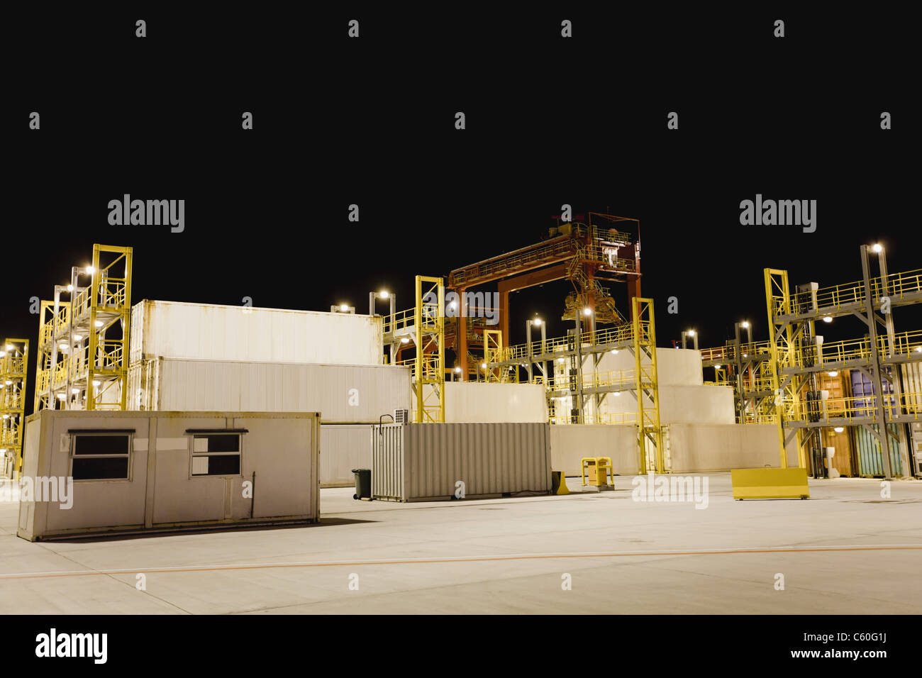 Containers and cranes in shipyard Stock Photo - Alamy