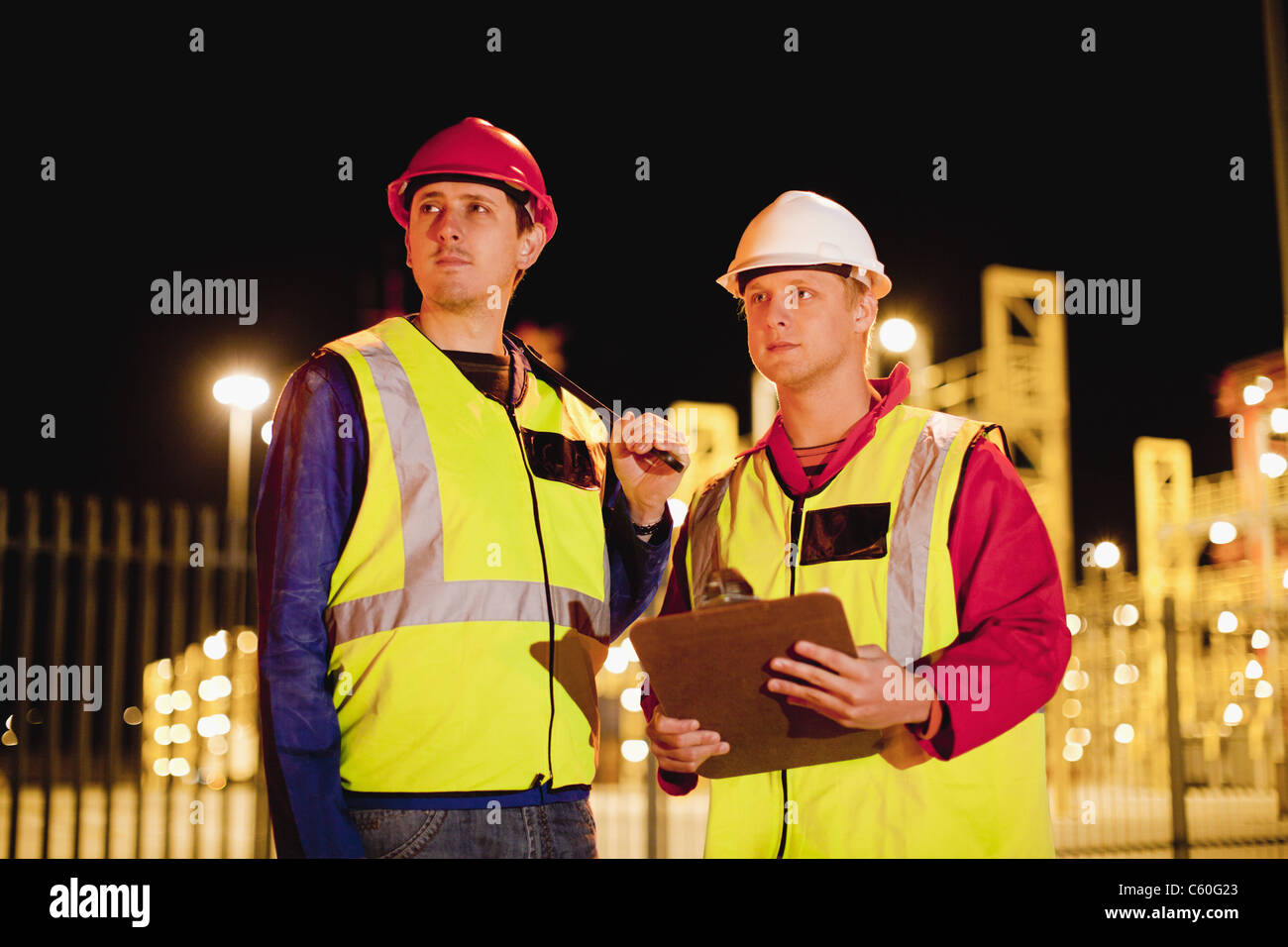 Workers standing together in shipyard Stock Photo - Alamy