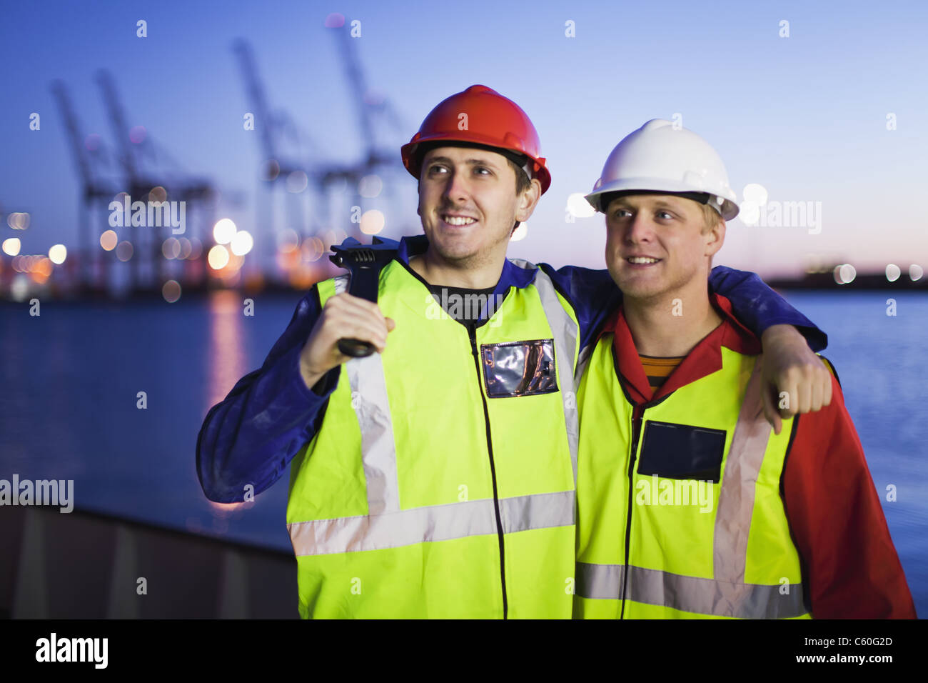 Workers standing together in shipyard Stock Photo - Alamy