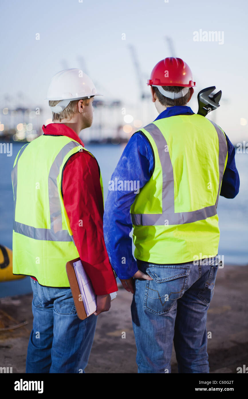 Workers standing together in shipyard Stock Photo - Alamy
