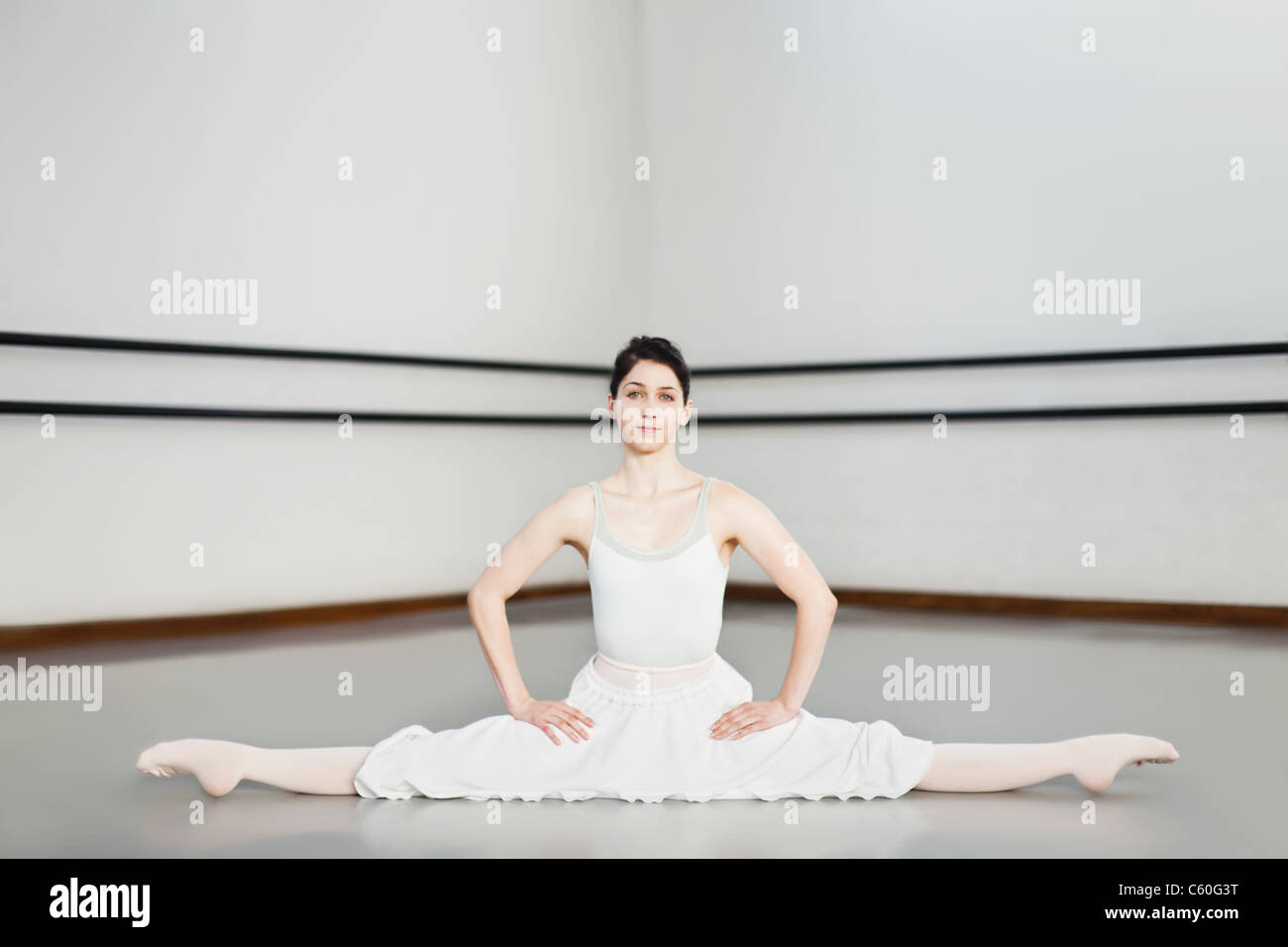 Ballet dancer doing splits in studio Stock Photo - Alamy