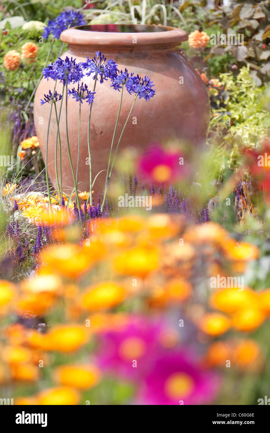 Large garden vase water feature in flowerbed, England, UK Stock Photo ...