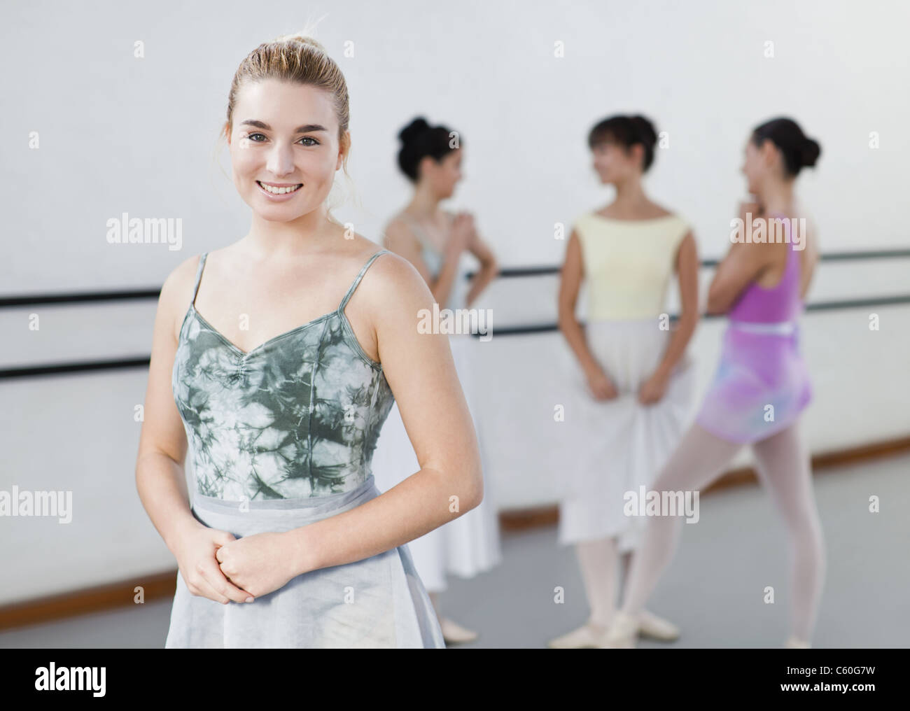 Smiling ballet dancer in studio Stock Photo - Alamy