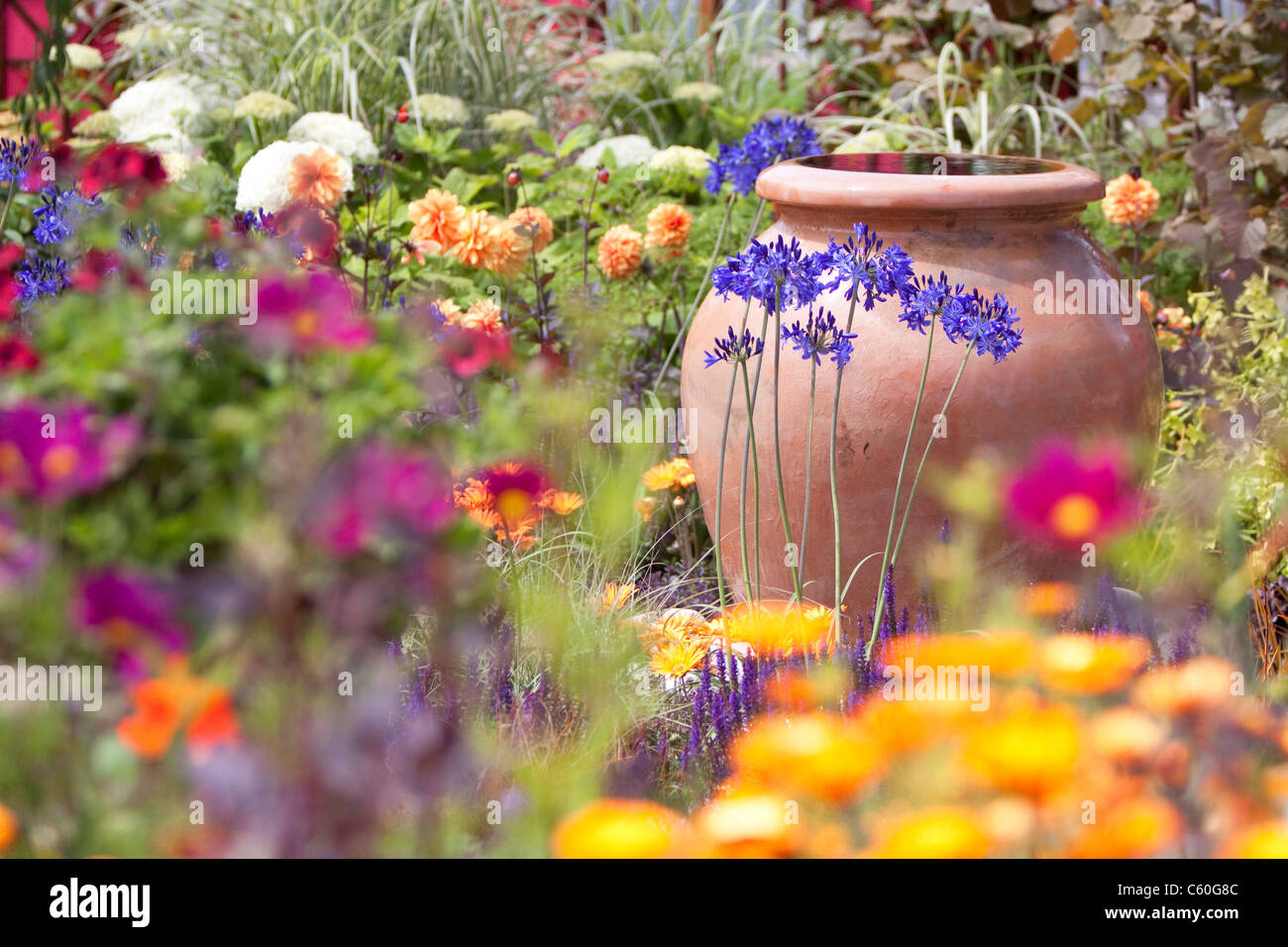 Large garden vase water feature in flowerbed, England, UK Stock Photo ...
