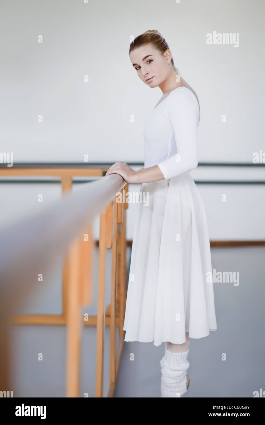 Ballet dancer standing at barre Stock Photo - Alamy