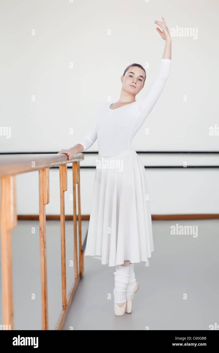 Ballet dancer posing at barre Stock Photo - Alamy