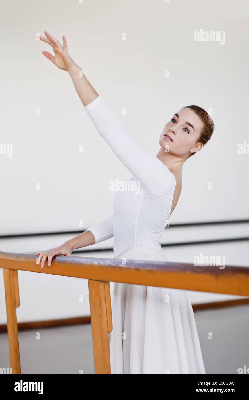 Ballet dancer posing at barre Stock Photo - Alamy