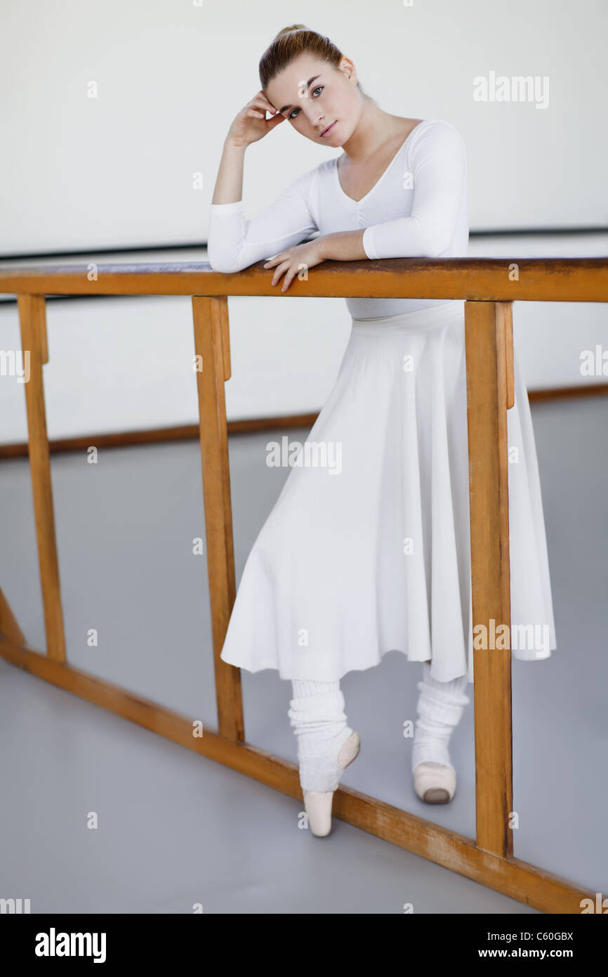 Ballet dancer standing at barre Stock Photo - Alamy
