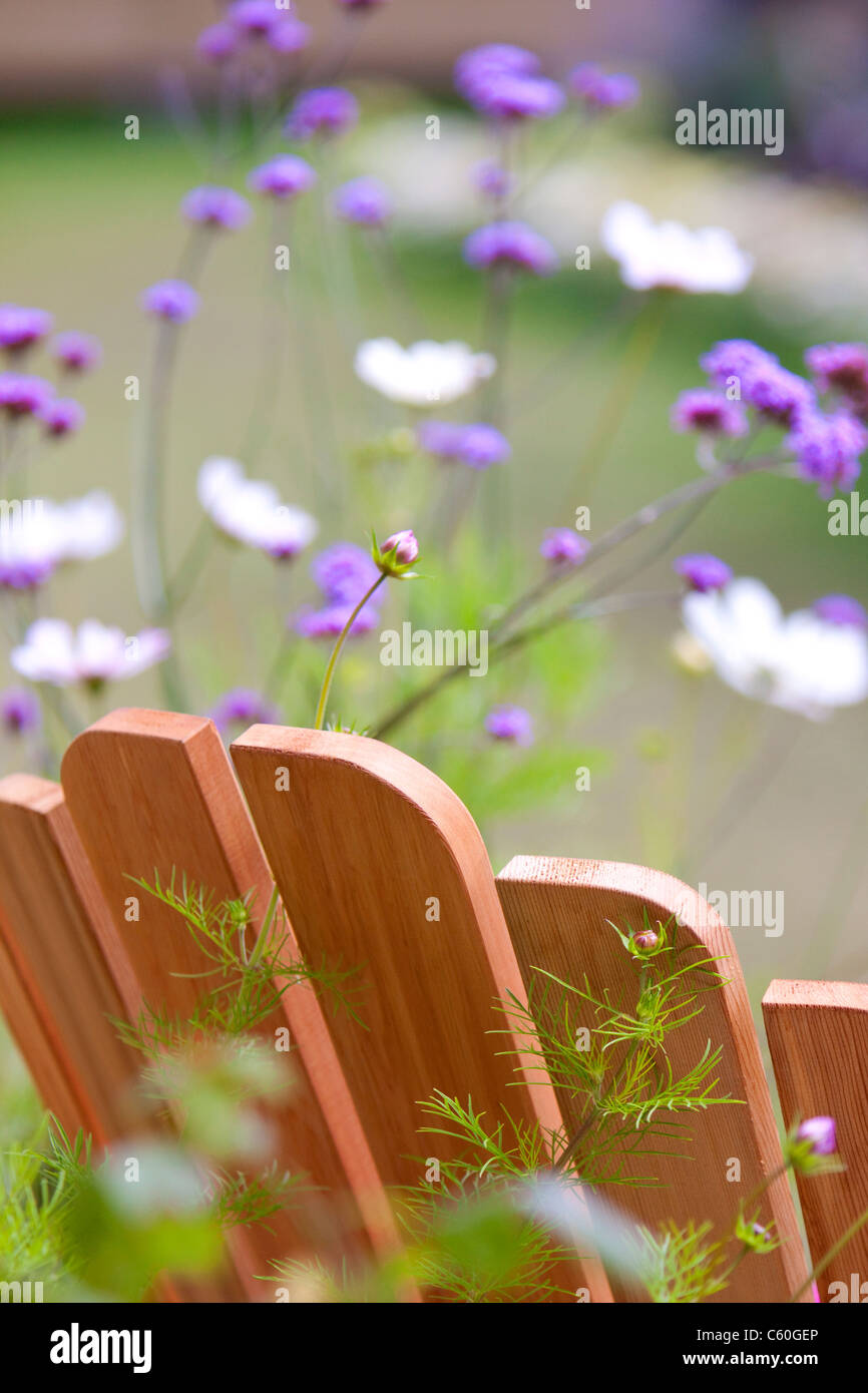 Wooden seat in flower garden, England, UK Stock Photo - Alamy