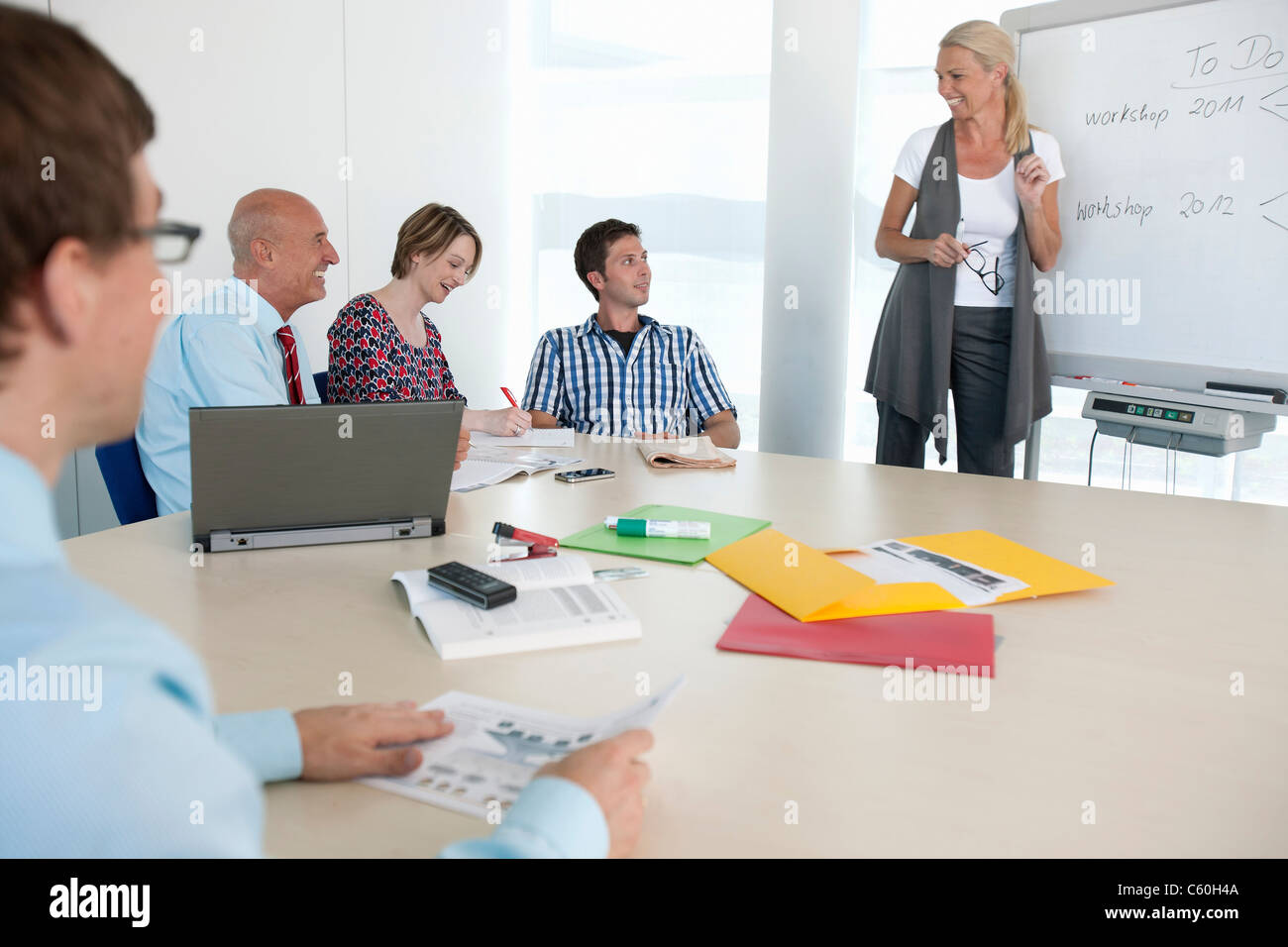 Communication sitting smiling authority conference table hi-res stock ...