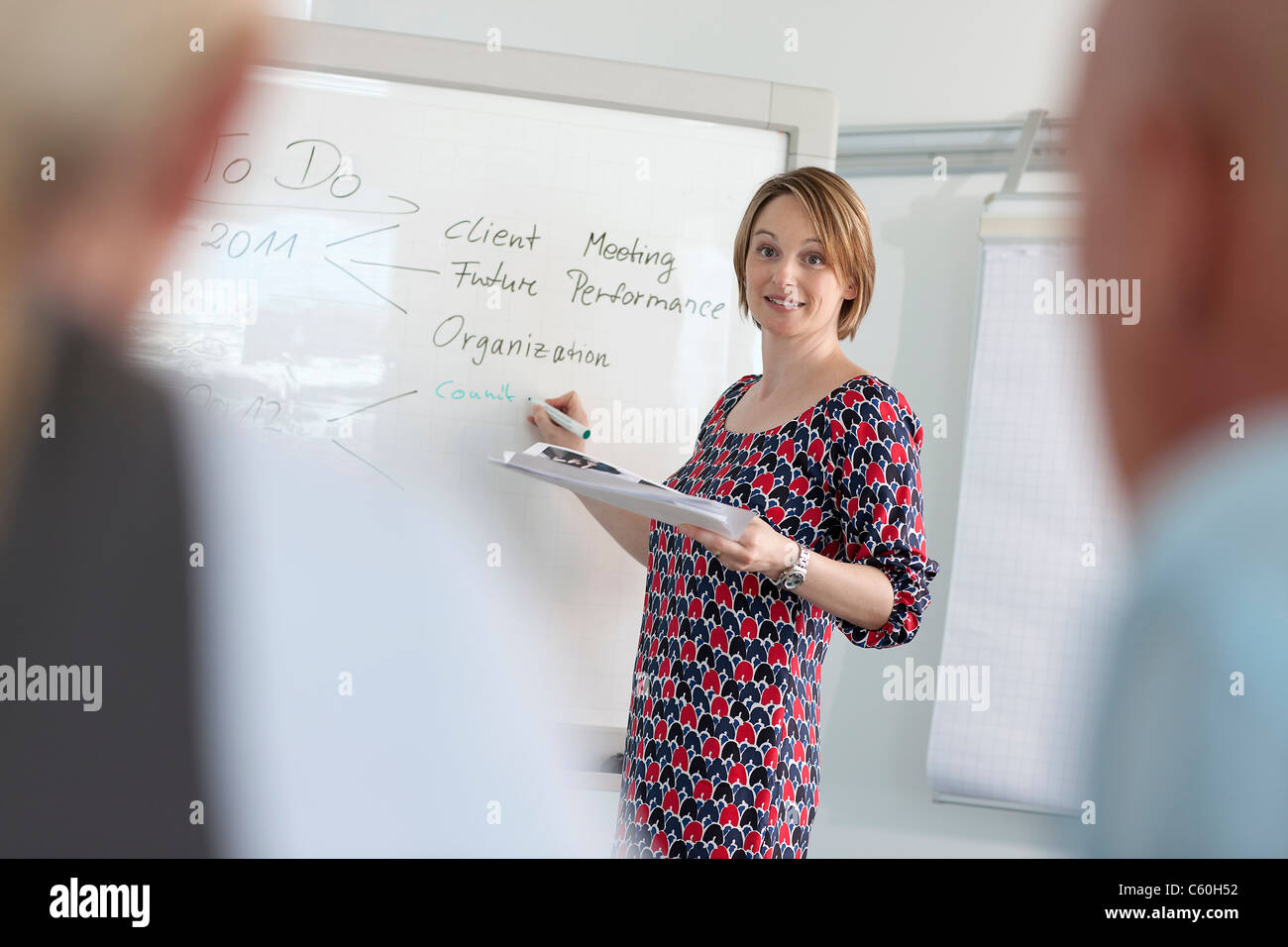 Mature businesswoman presenting ideas hi-res stock photography and ...