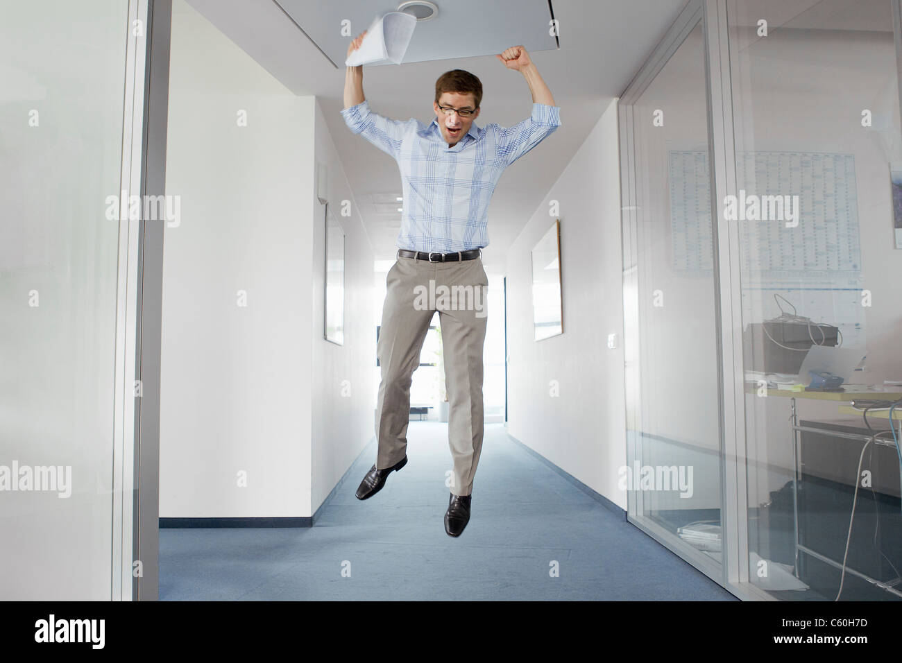 Man jumping joy office hi-res stock photography and images - Alamy