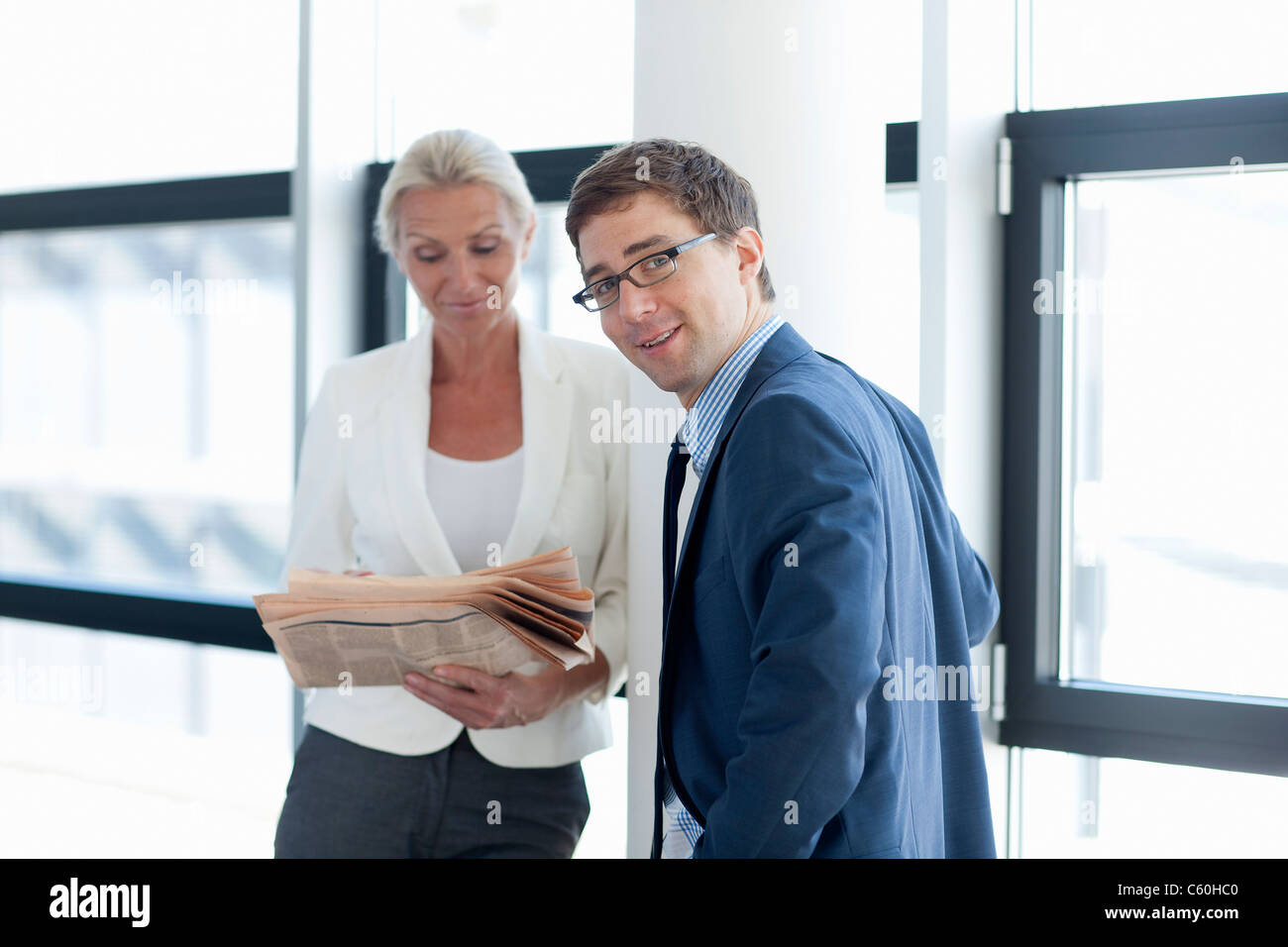 Business people talking in office Stock Photo - Alamy