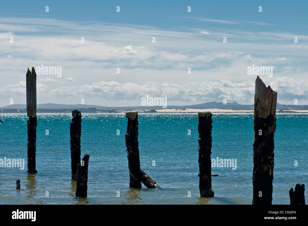 Beautiful rotten mooring on a beach where only the pillars are left ...