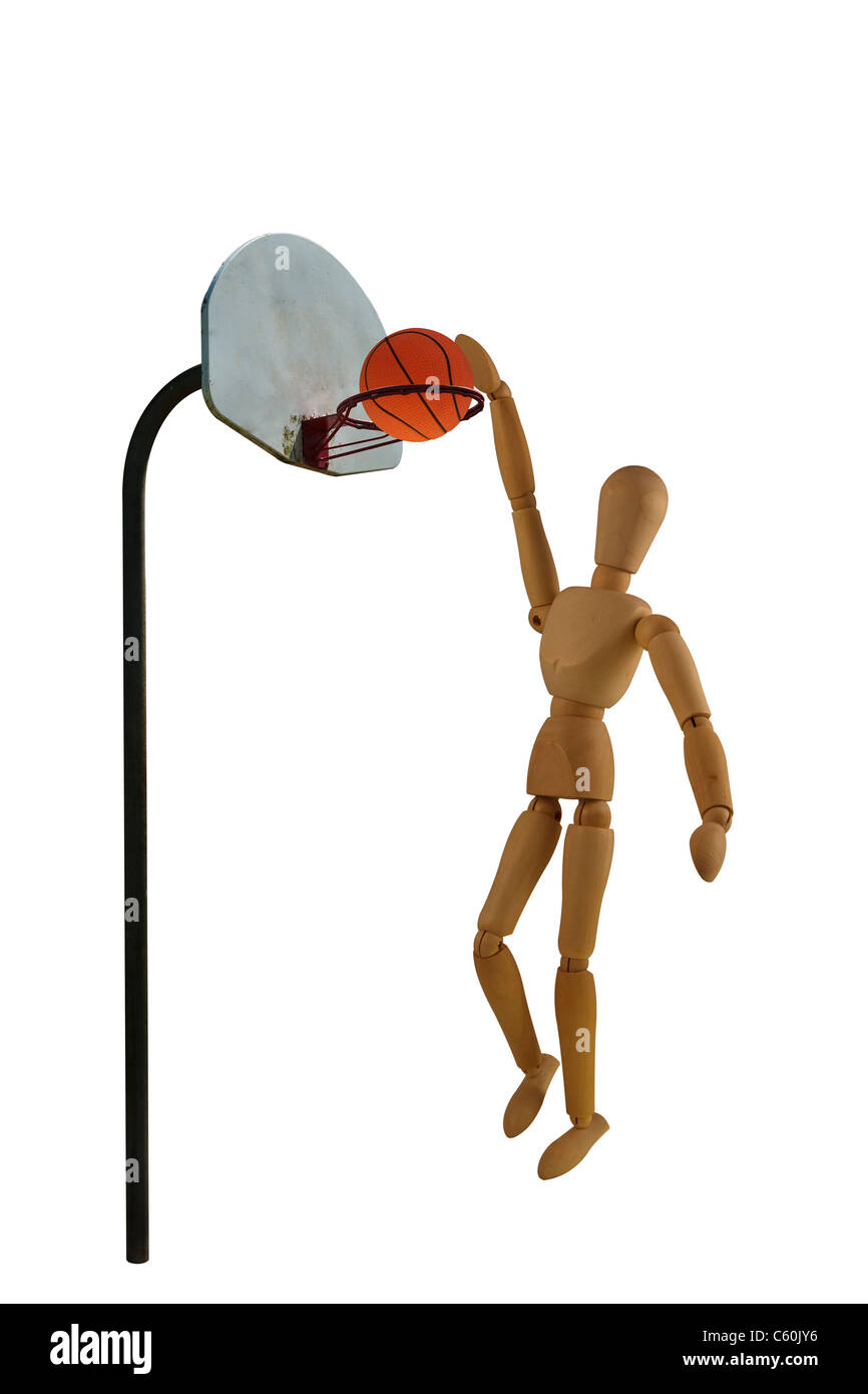 Wooden mannequin playing basketball Stock Photo - Alamy