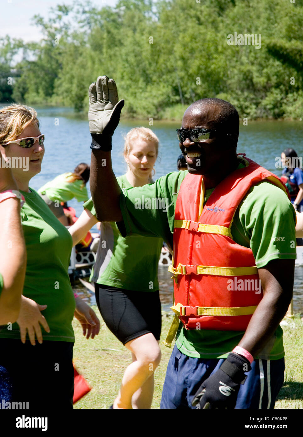 The Dragonauts dragon boat crew give high-5's at the21st TELUS Stock ...