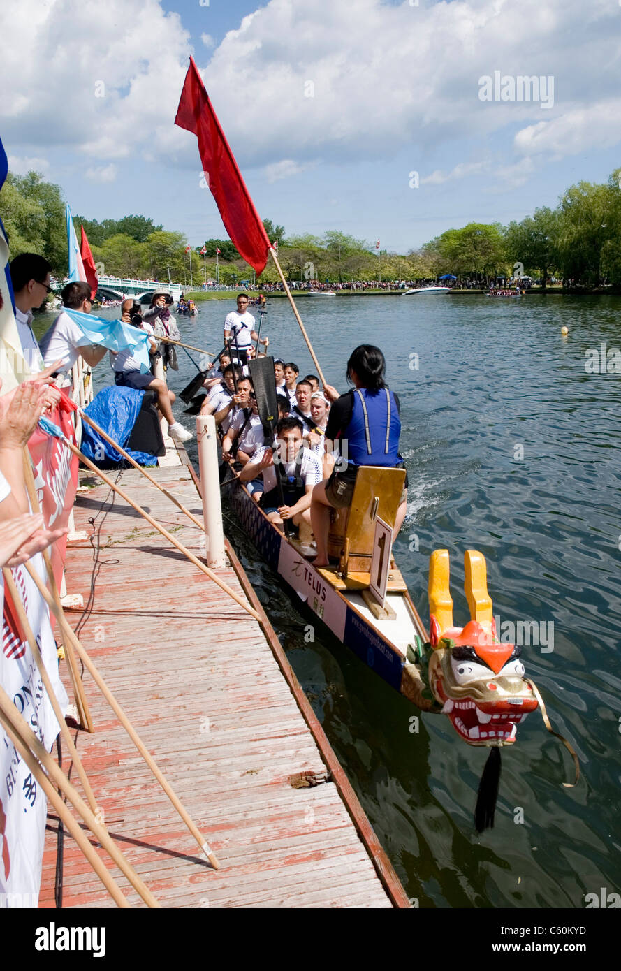 Piranhas DBC Dragon Boat collecting their flag for finishing in sixth ...
