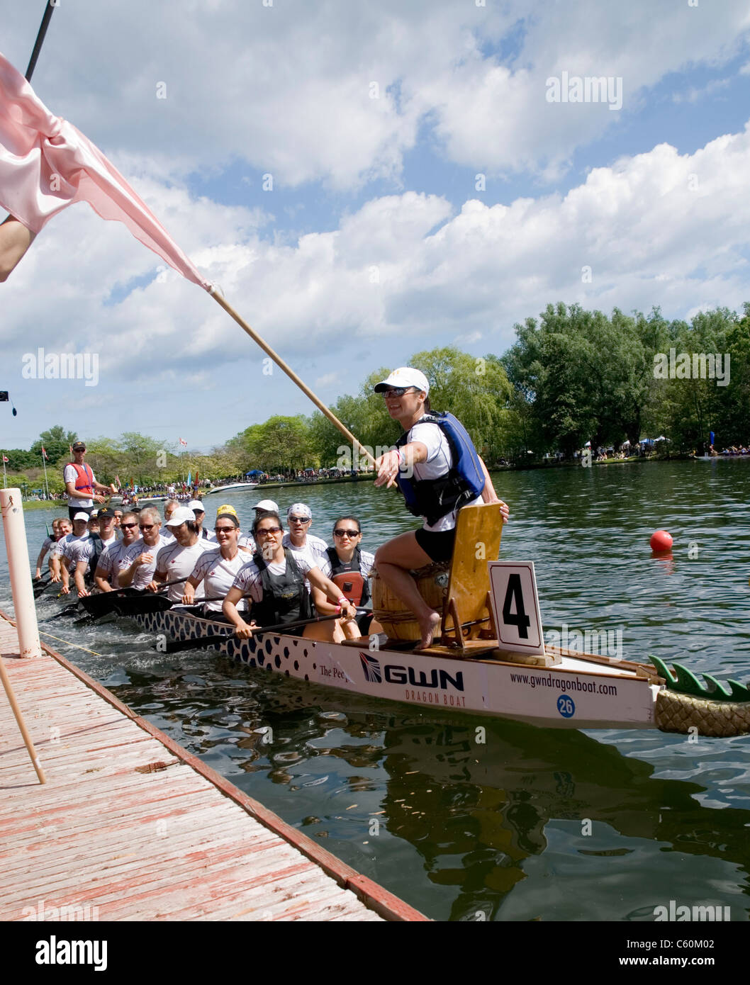 Outer Harbour DBC Mayfair Predators Dragon Boat collecting their flag ...