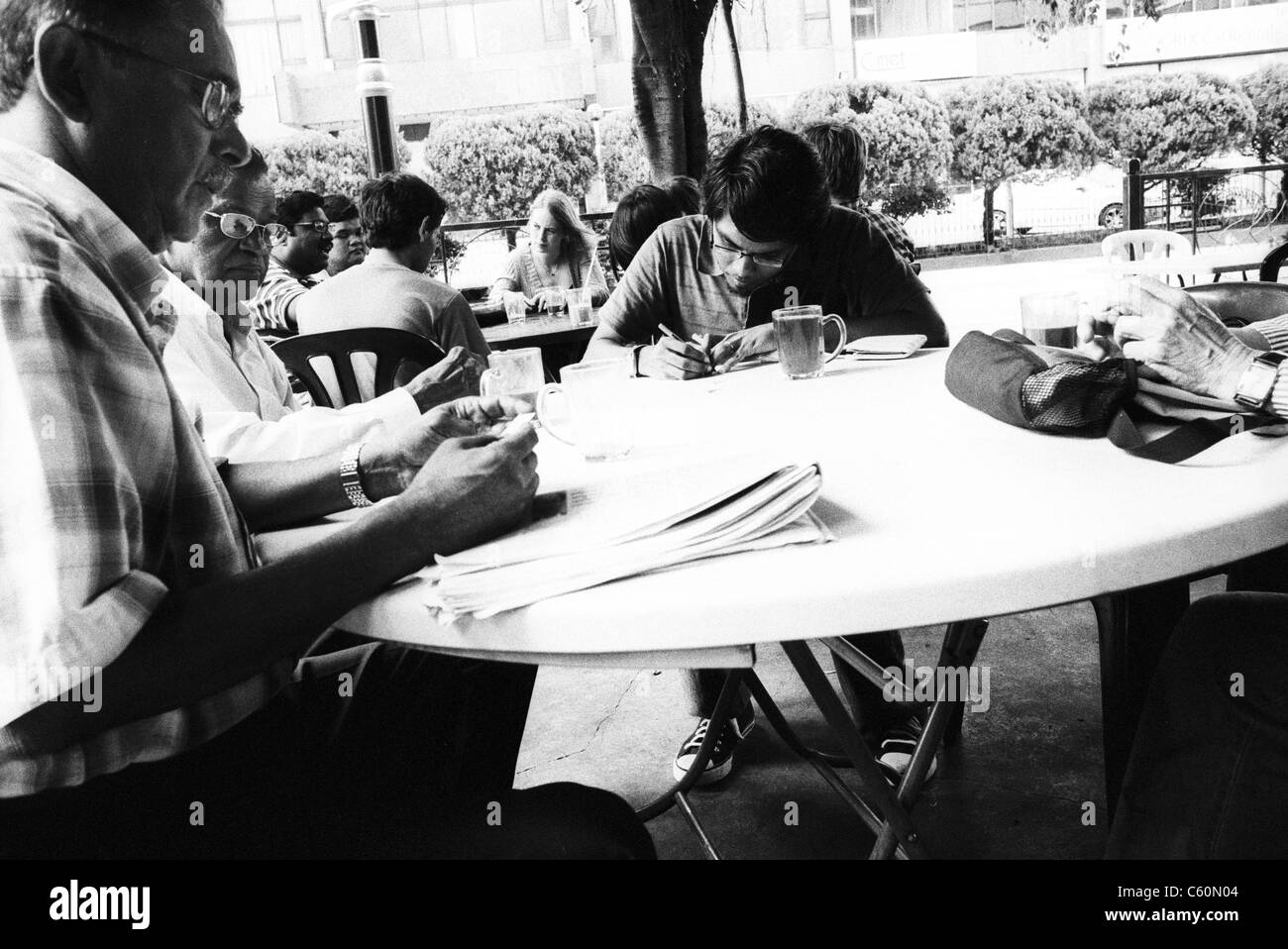 seelan palay taking notes while discussing with gandhi ambalam at ...