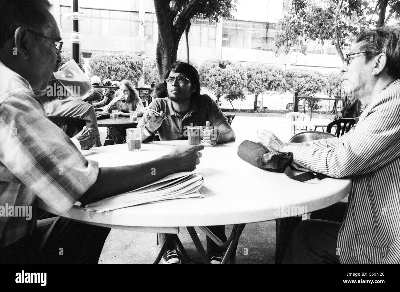 seelan palay discussing with gandhi ambalam and robert yeo at the ...