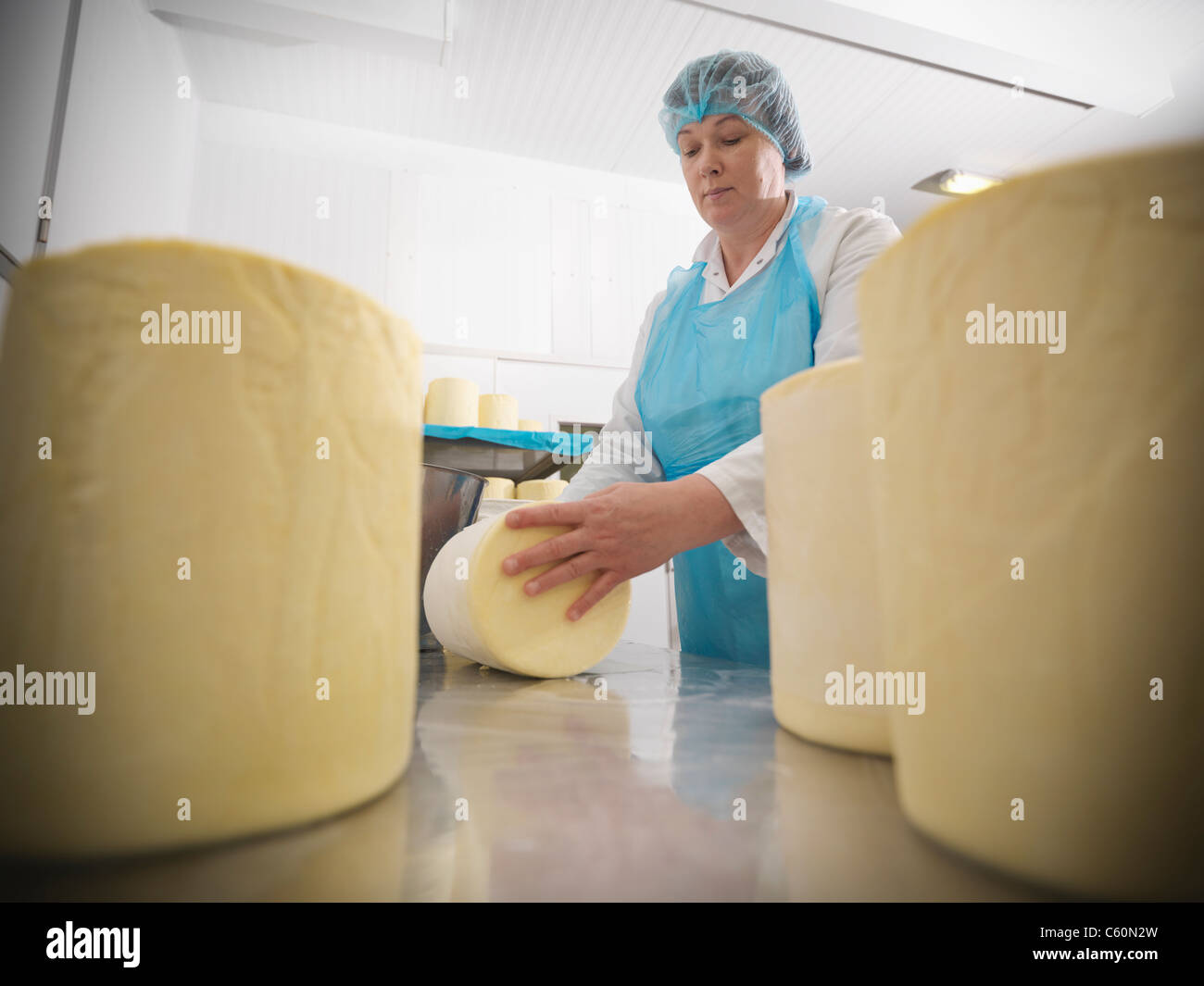 Wrapping cheese in factory hi-res stock photography and images - Alamy