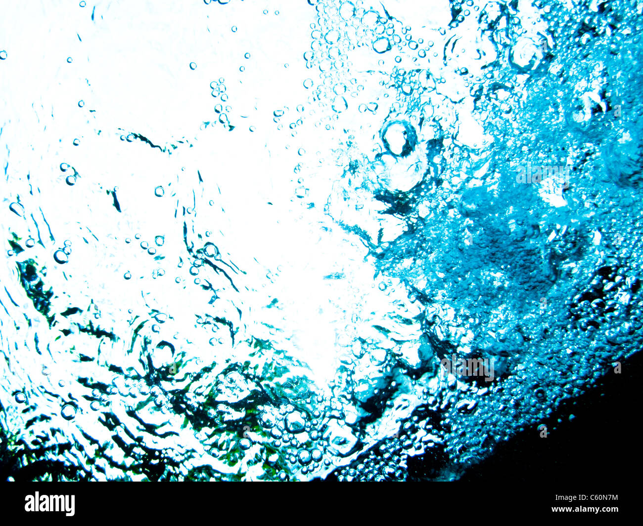 Blue white water bubbles in a pool which lock like boiling water in a ...