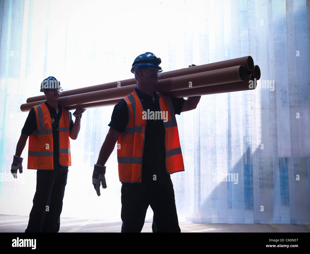 Two men carrying industry hi-res stock photography and images - Alamy