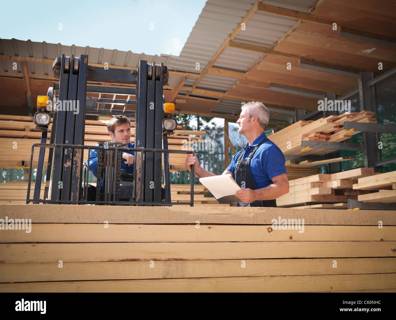 Carrying planks hi-res stock photography and images - Alamy