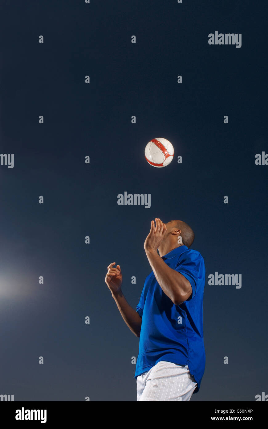 Soccer ball on head hi-res stock photography and images - Alamy