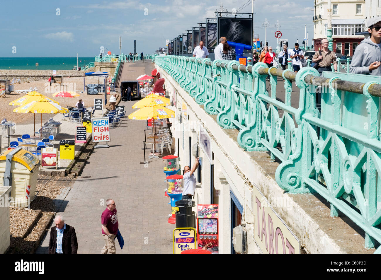 Brighton East Sussex King's Road promenade people crowds beach shops ...