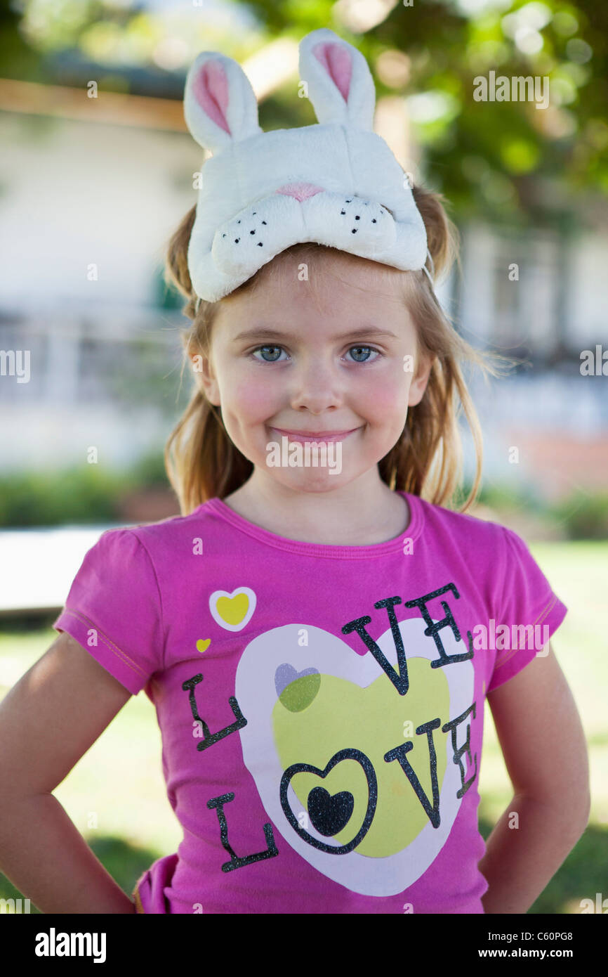 Girl wearing rabbit mask outdoors Stock Photo - Alamy