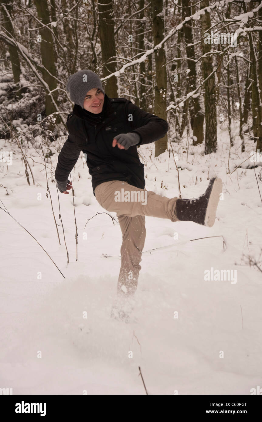 Kicking the Snow Stock Photo - Alamy