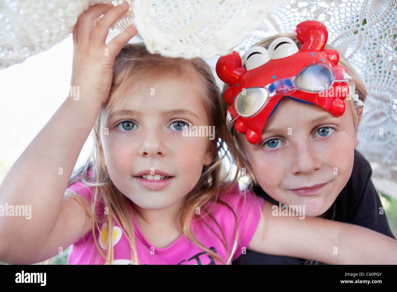 Children playing under blanket Stock Photo - Alamy
