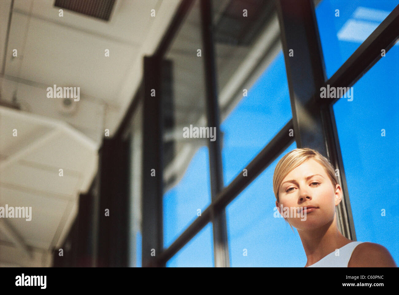 Woman sitting in front of the window hi-res stock photography and ...