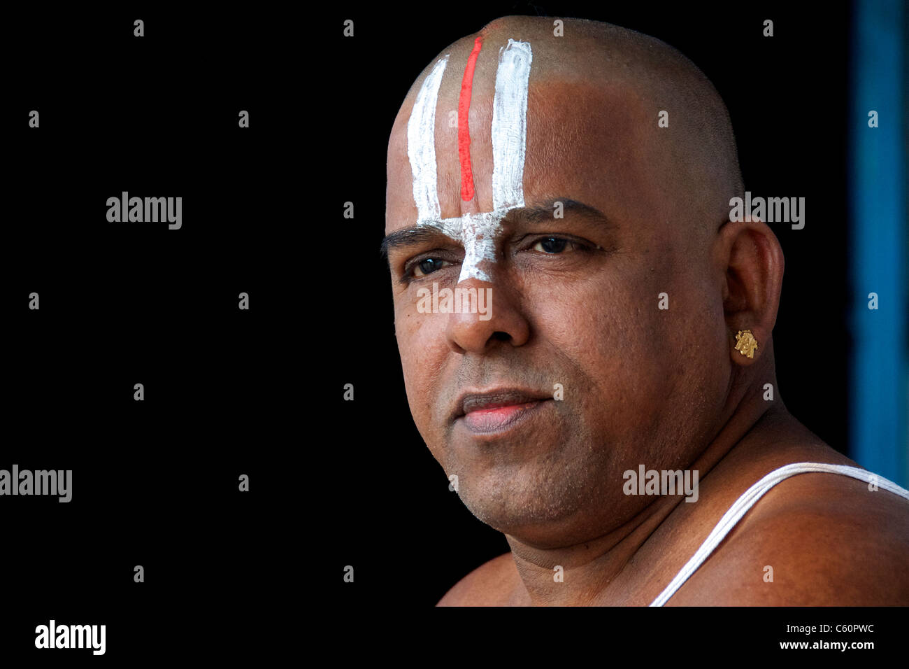 Seated priest hi-res stock photography and images - Alamy