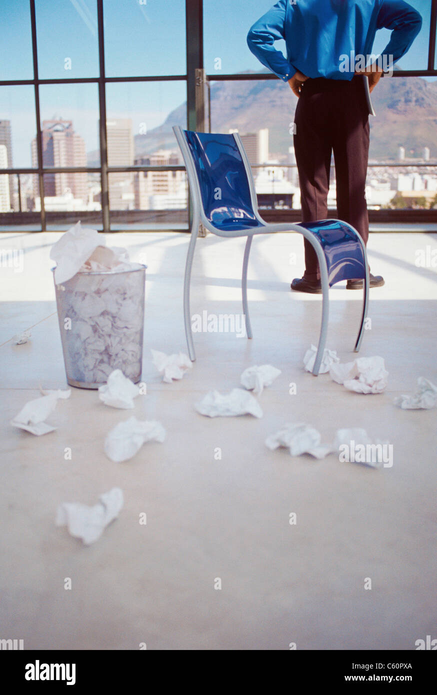 Businessman crumpling papers in office Stock Photo - Alamy