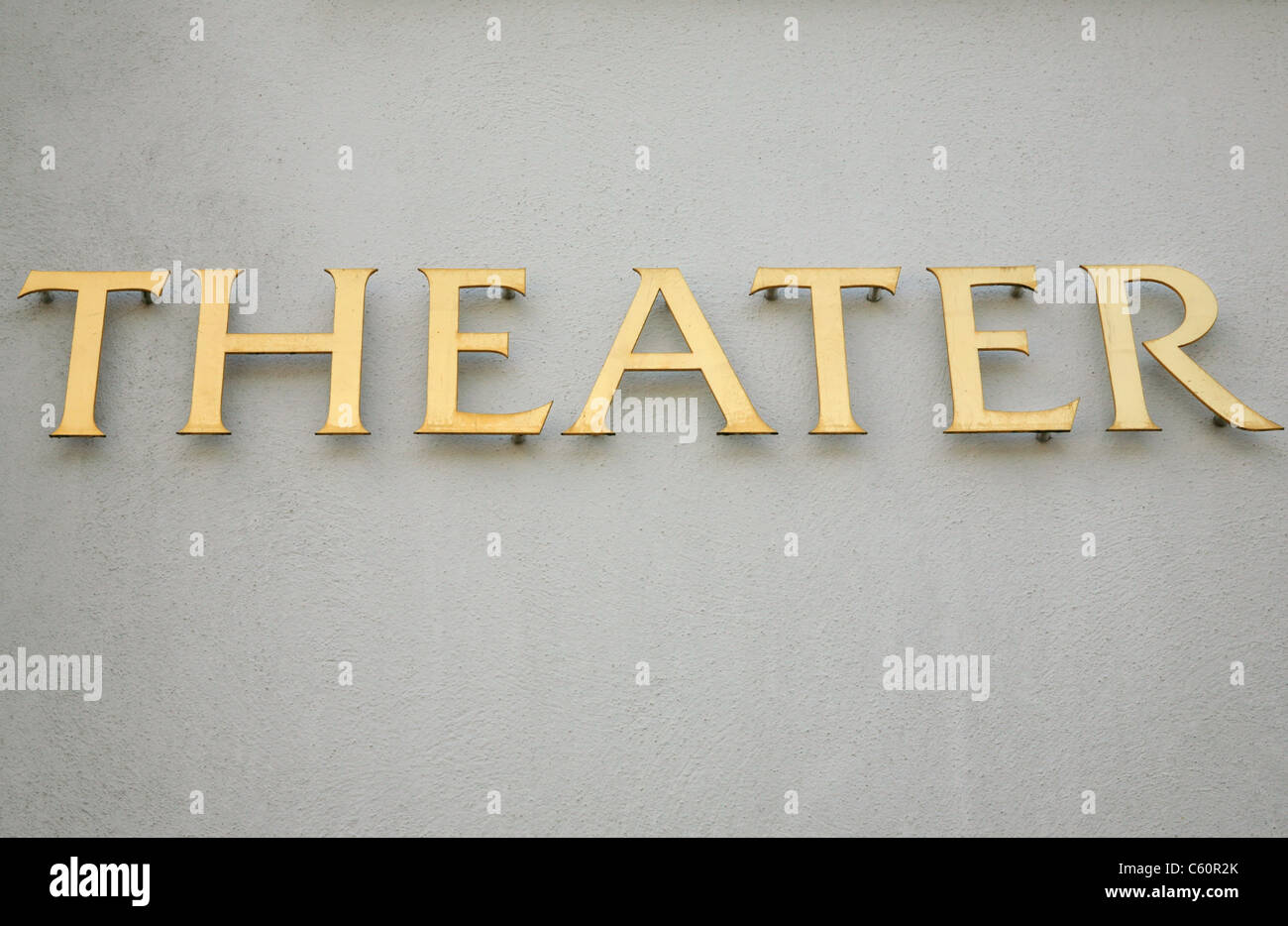 The word theater in golden letters Stock Photo - Alamy
