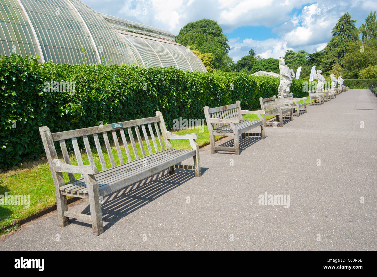 Benches on a path in a park Stock Photo - Alamy