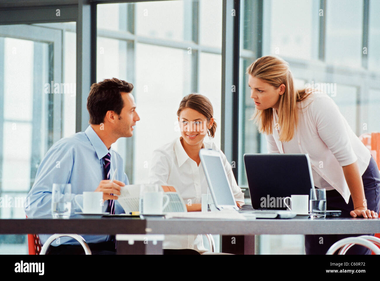 Business people working at desk Stock Photo - Alamy