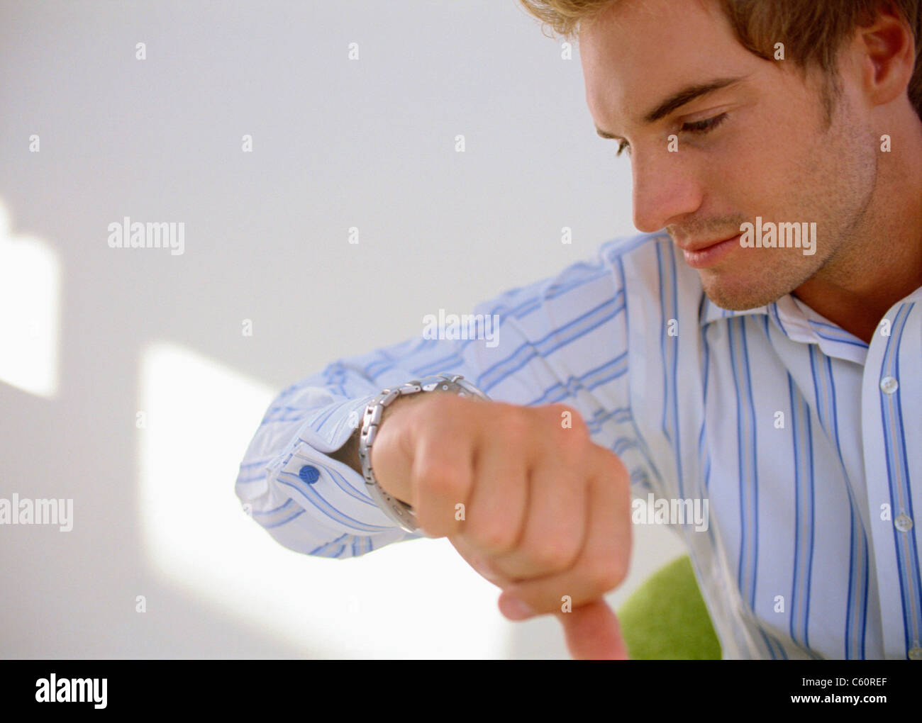 Man checking his watch Stock Photo - Alamy