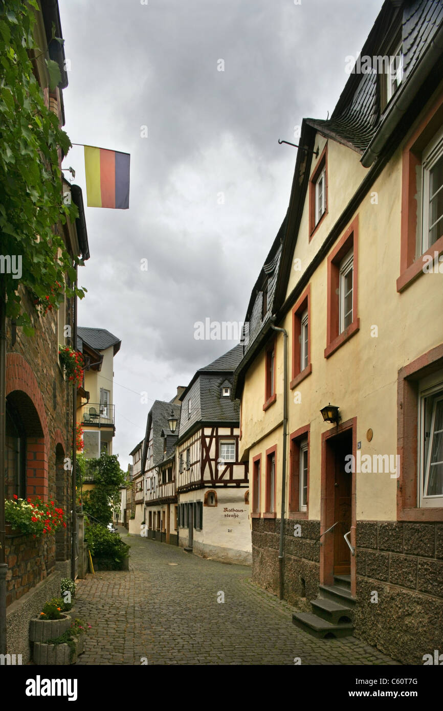 Traditional cobbled street with half-timbered buildings in the village ...
