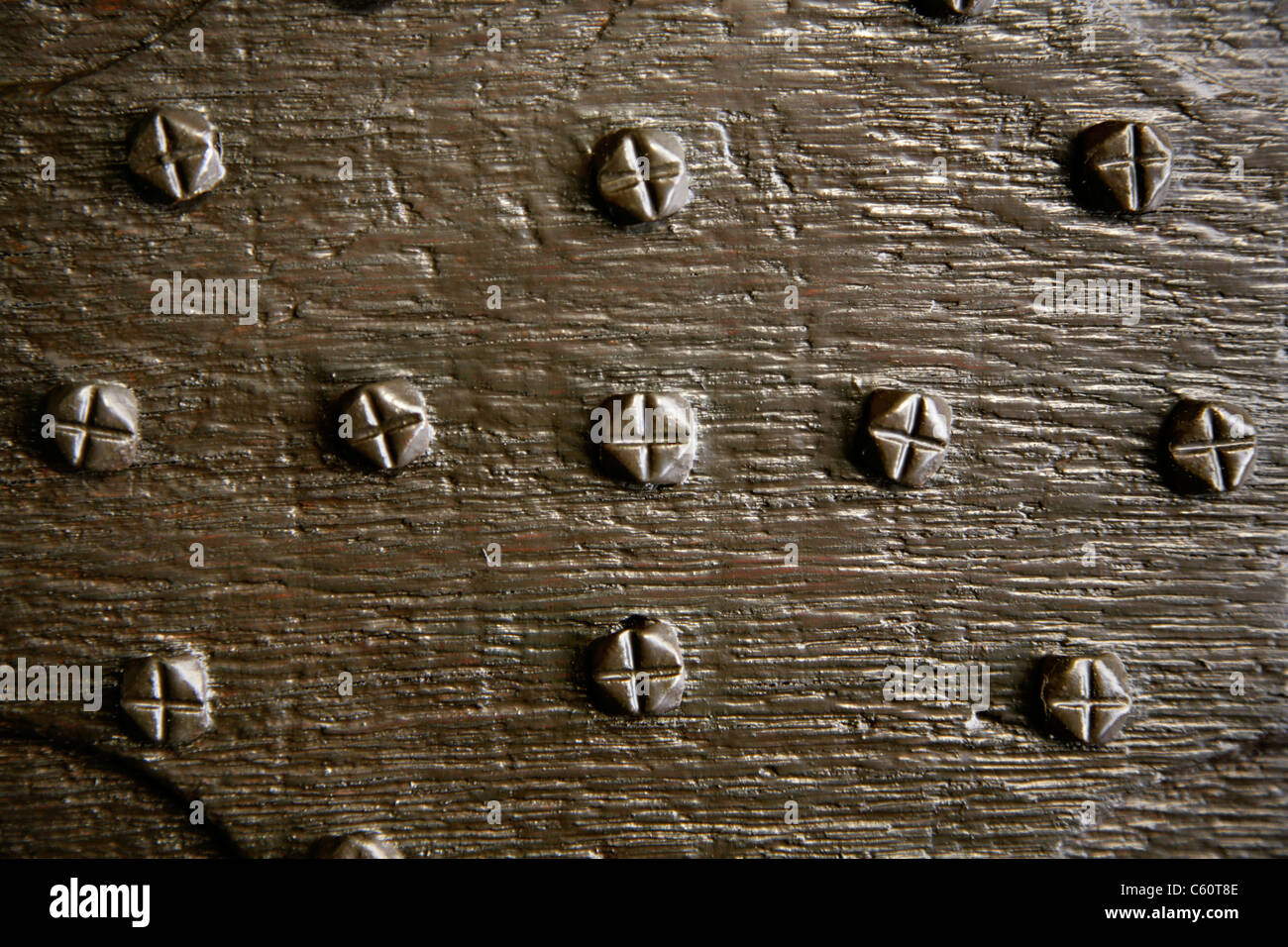 Detail of old handmade screws in timber door Stock Photo - Alamy