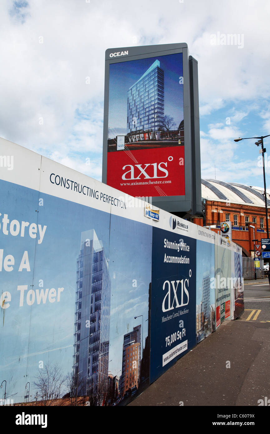 Photographs on fence and LCD screen of the non-existing Axis tower in ...