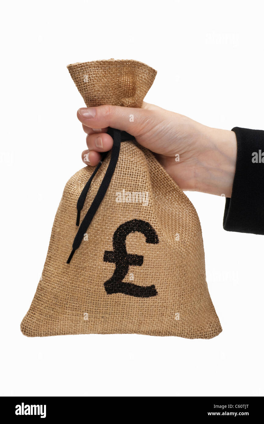ein Geldsack mit Pfund-Symbol wird in der Hand gehalten | a money bag ...